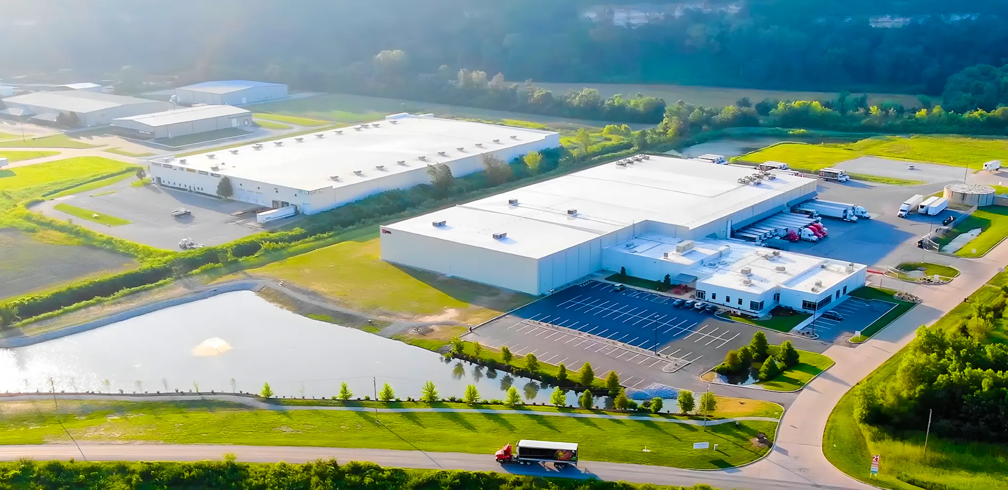 A distribution center with trucks parked outside